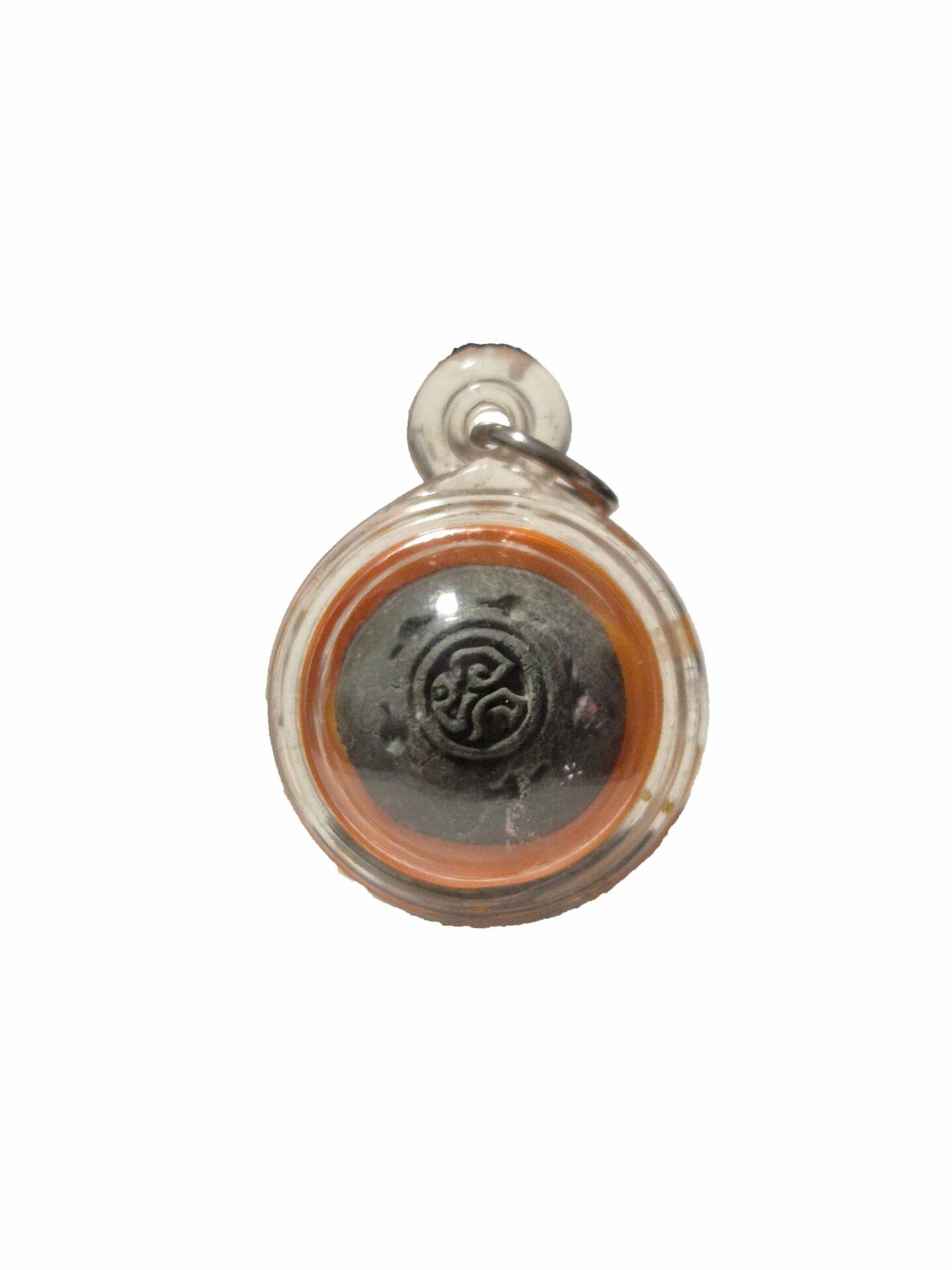 Loop Om is a small and round amulet made of sacred holy powder.